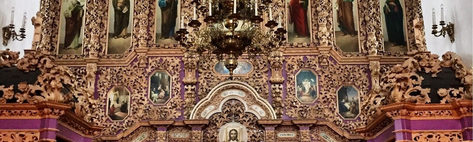 Instead of gold covered, the iconostasis and everything inside the church is delicate, intricately carved wood.