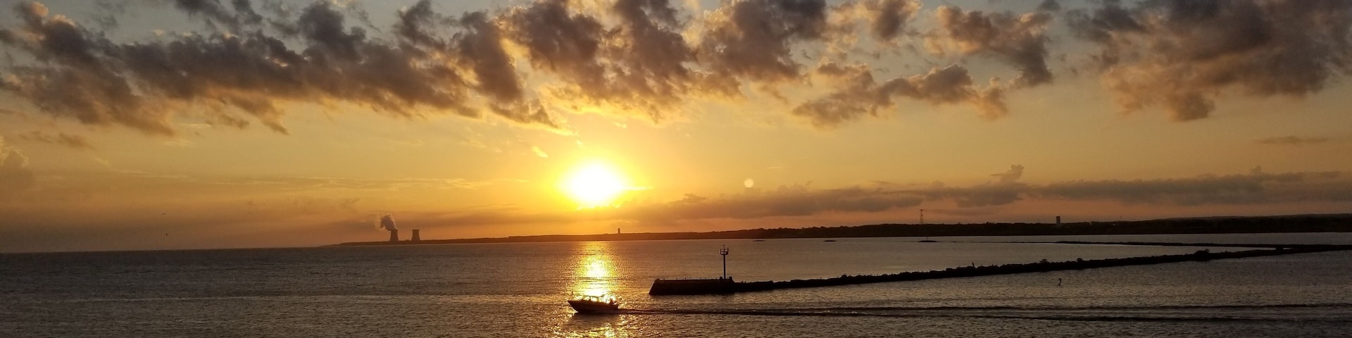 Every morning, when the weather is warm, just as the sun is rising, fishermen head out Lake Erie to fish for locally prized perch and walleye. This photo captures that morning ritual.
