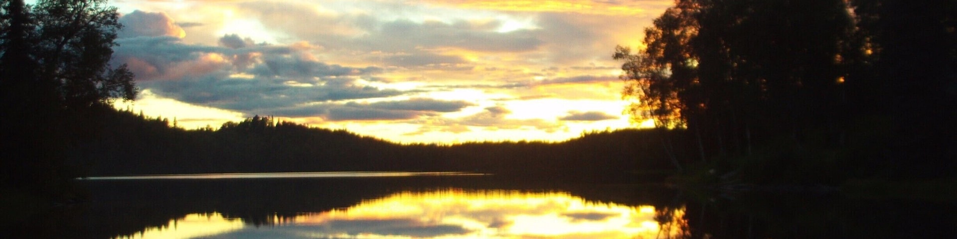 A vivid sunset over Lake Bulchitna caps the end of a fantastic day fishing and hiking.